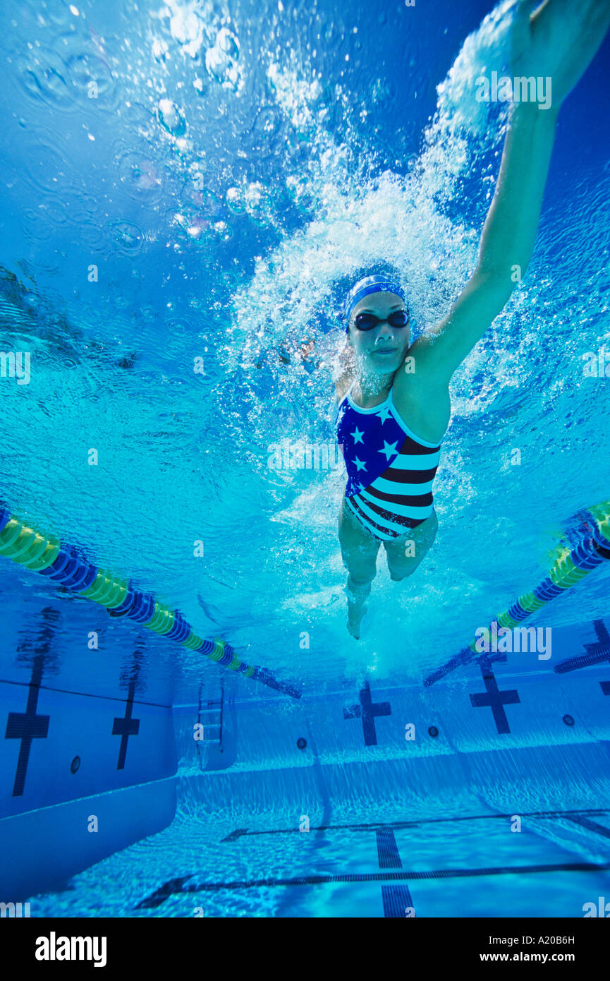 Woman swimming underwater, (low angle view Stock Photo - Alamy