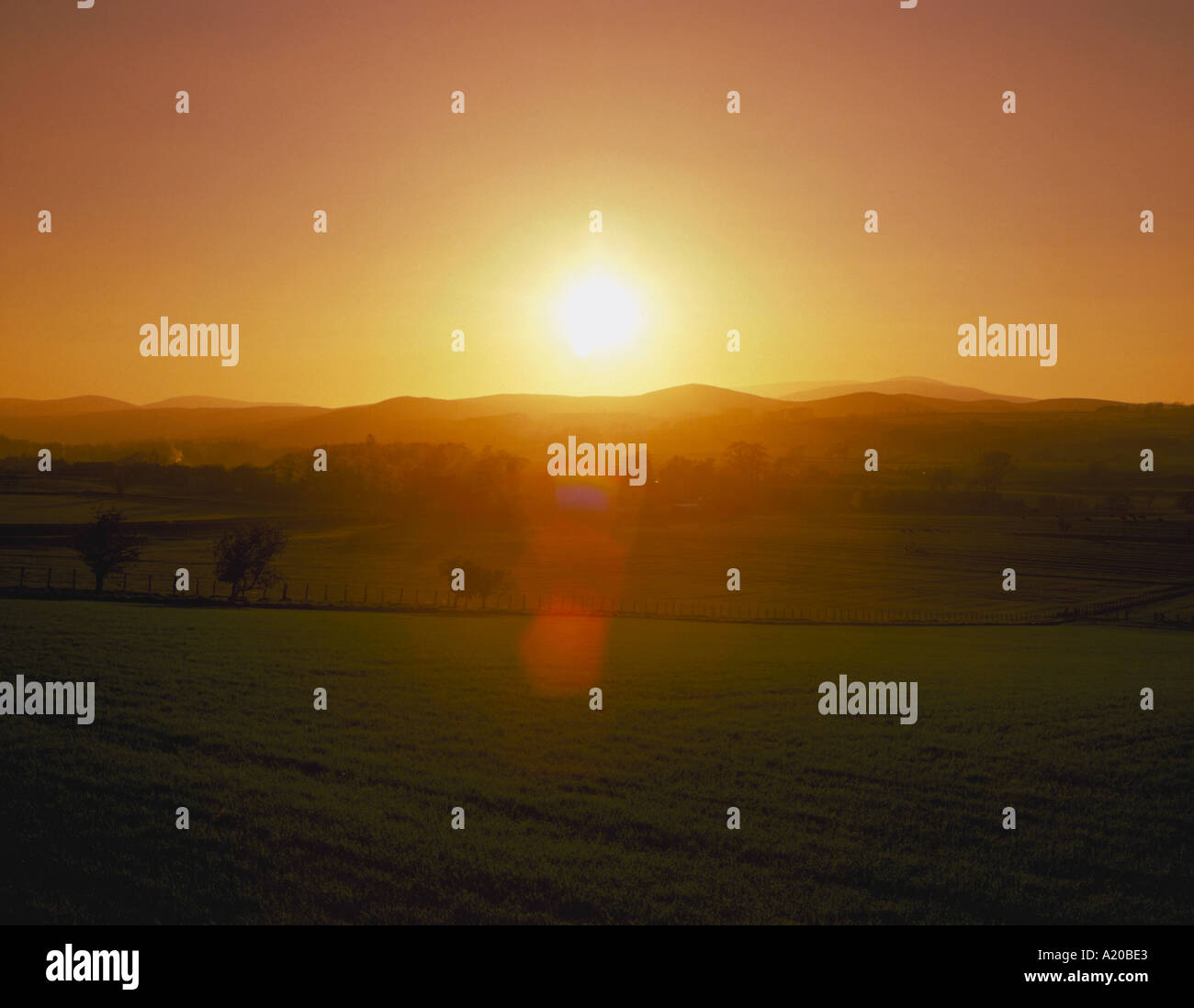 Sunset over the village of Whittingham and the Cheviot Hills ...