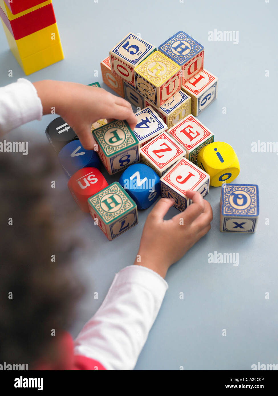 Boy playing with building blocks in classroom, view from above Stock ...