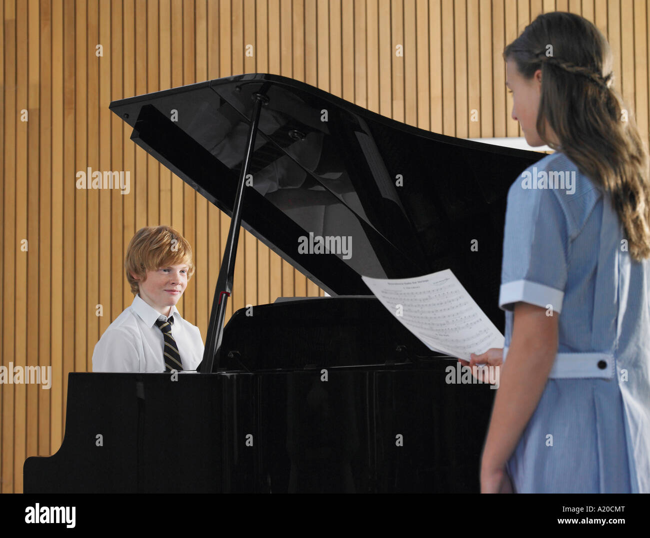Two students performing in music class Stock Photo - Alamy