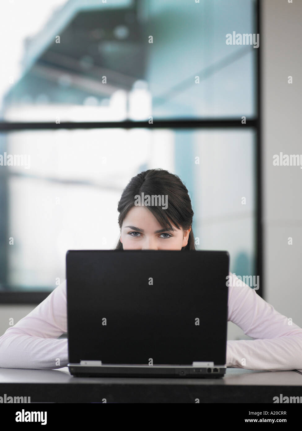 Teenage girl using laptop in classroom Stock Photo - Alamy