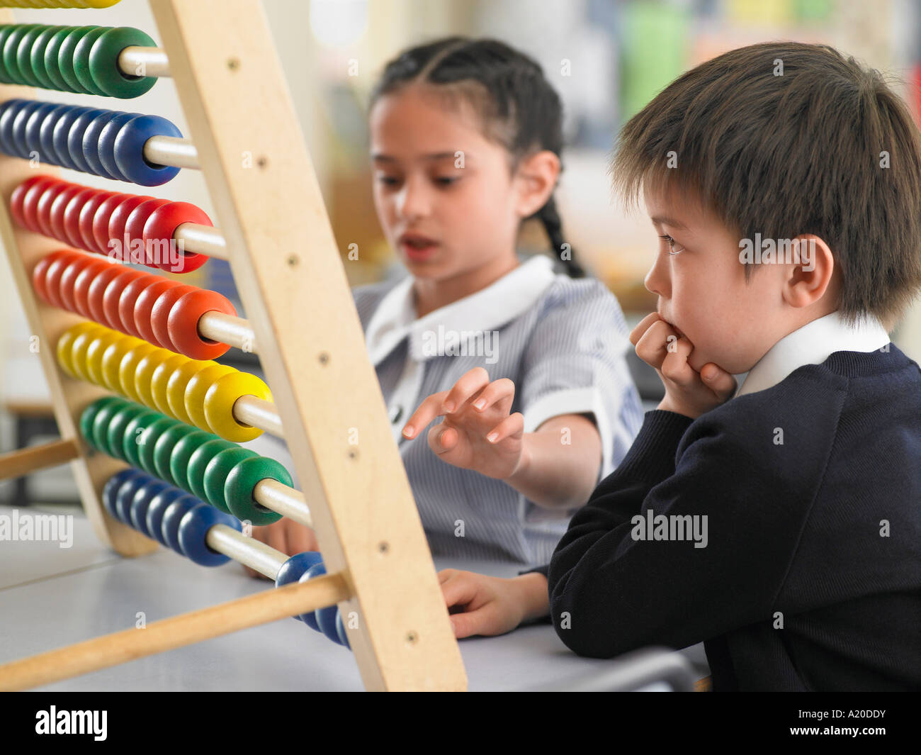 Elementary students using abacus in classroom Stock Photo - Alamy