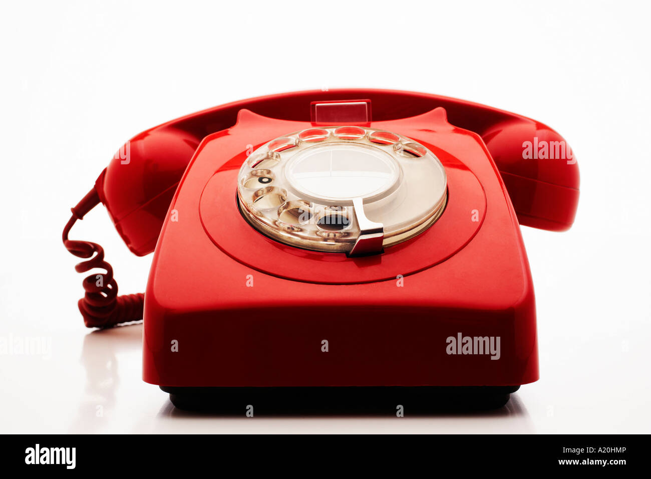Old fashioned red telephone in studio Stock Photo - Alamy