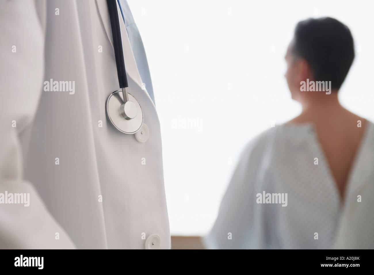 Doctor With Patient in Hospital, mid section of doctor Stock Photo - Alamy