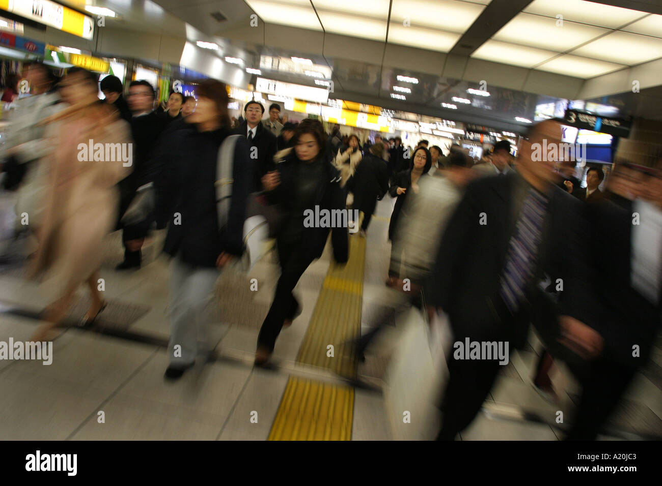Morning rush hour commuters make their way through Tokyo Central Train ...