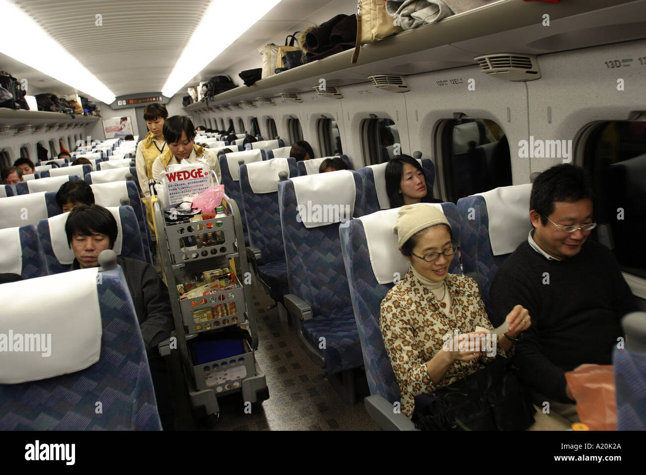 The food trolley and passengers in the interior of the Nozomi ...