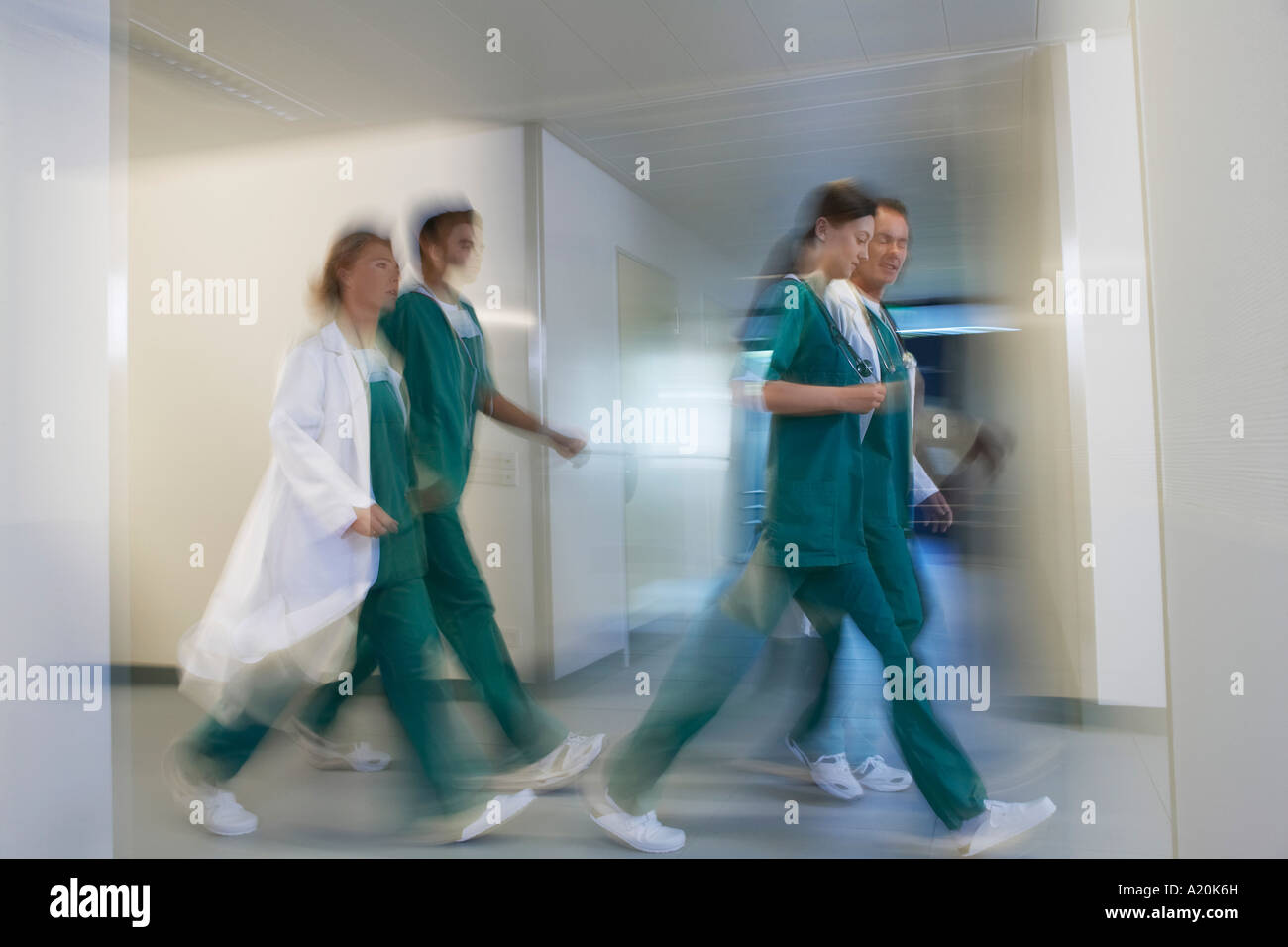 Physicians rushing through hospital Corridor, side view, motion blur ...