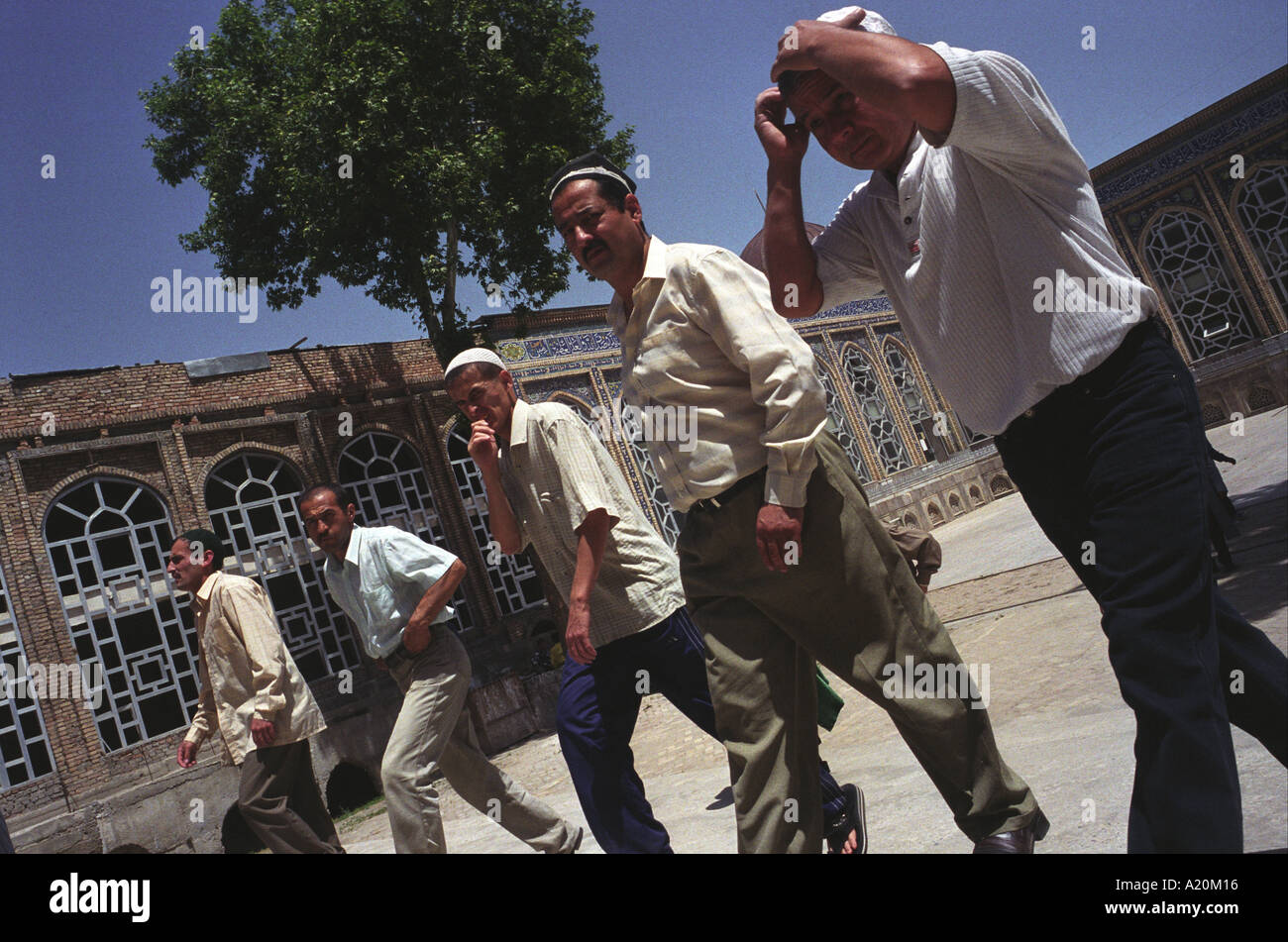 Men arrive for prayers at the Haji Yakoub mosque in Dushanbe ...