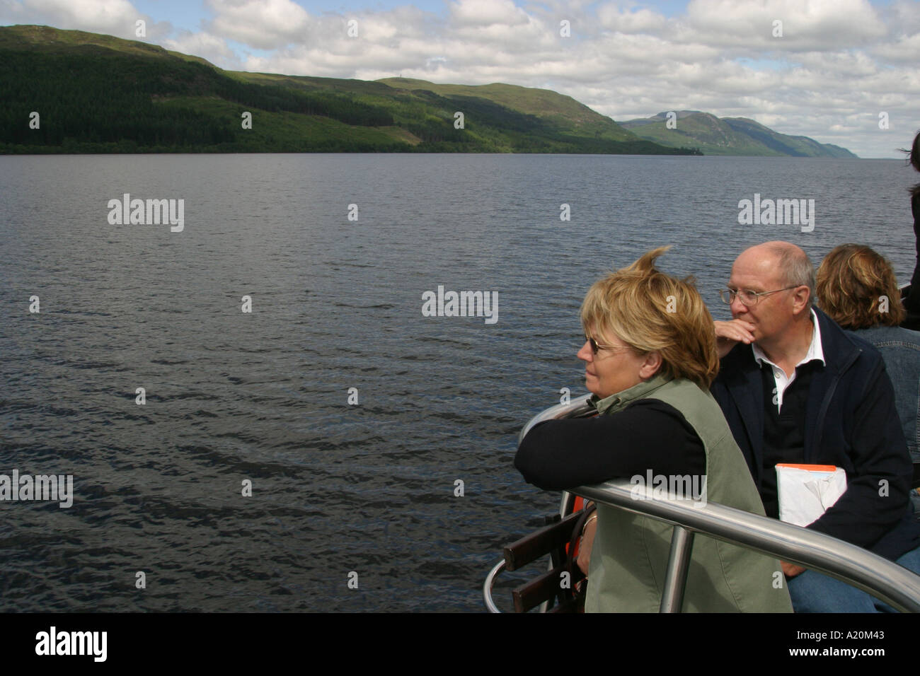 Tourists on a pleasure cruiser boat tour of Loch Ness keep an eye open ...