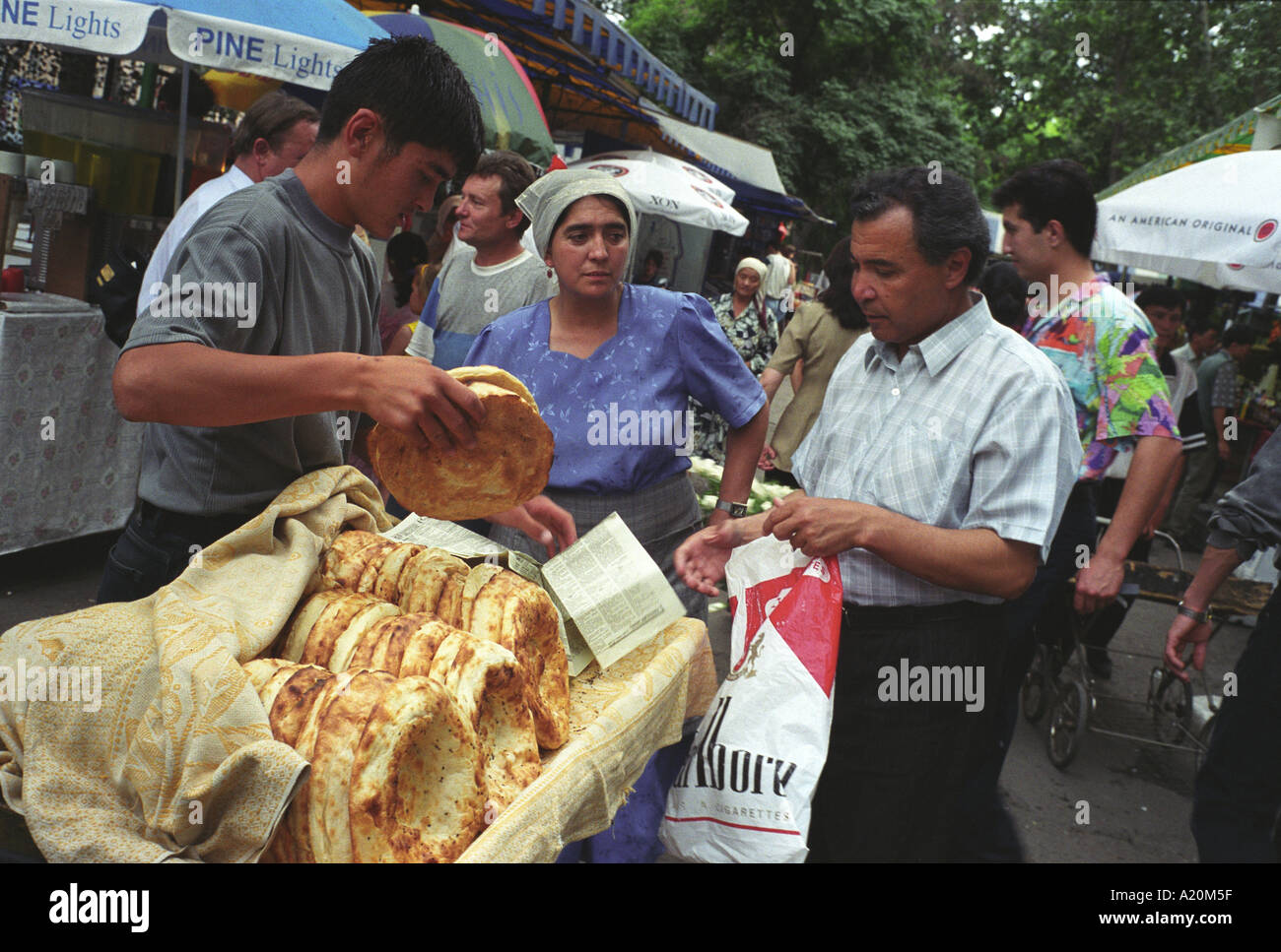 Selling bread in a market in Tashkent one of the cities on the old Silk ...