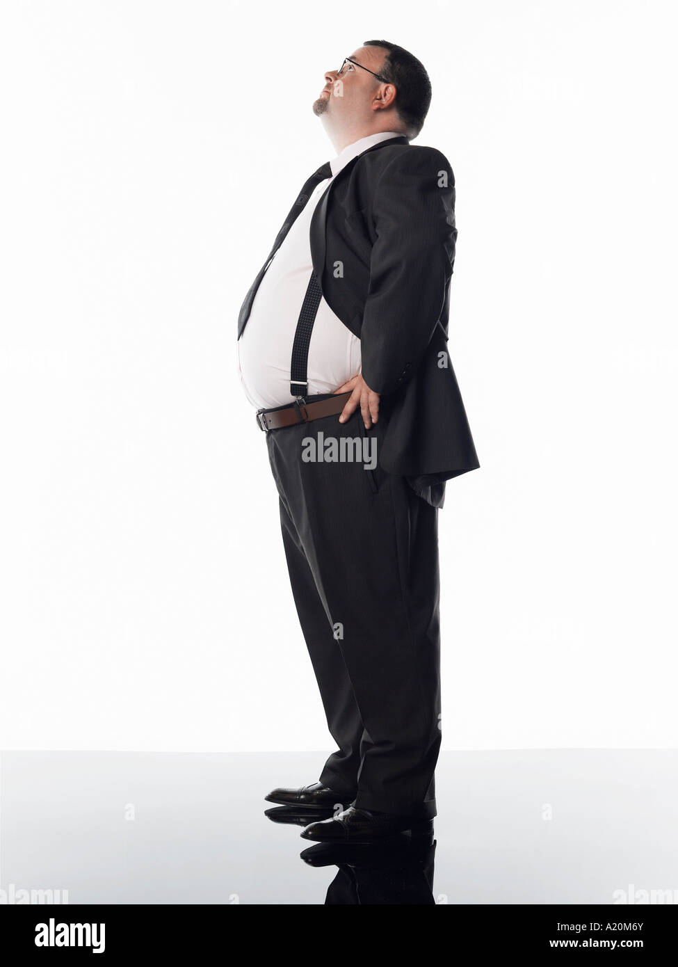 Overweight businessman, side view Stock Photo - Alamy