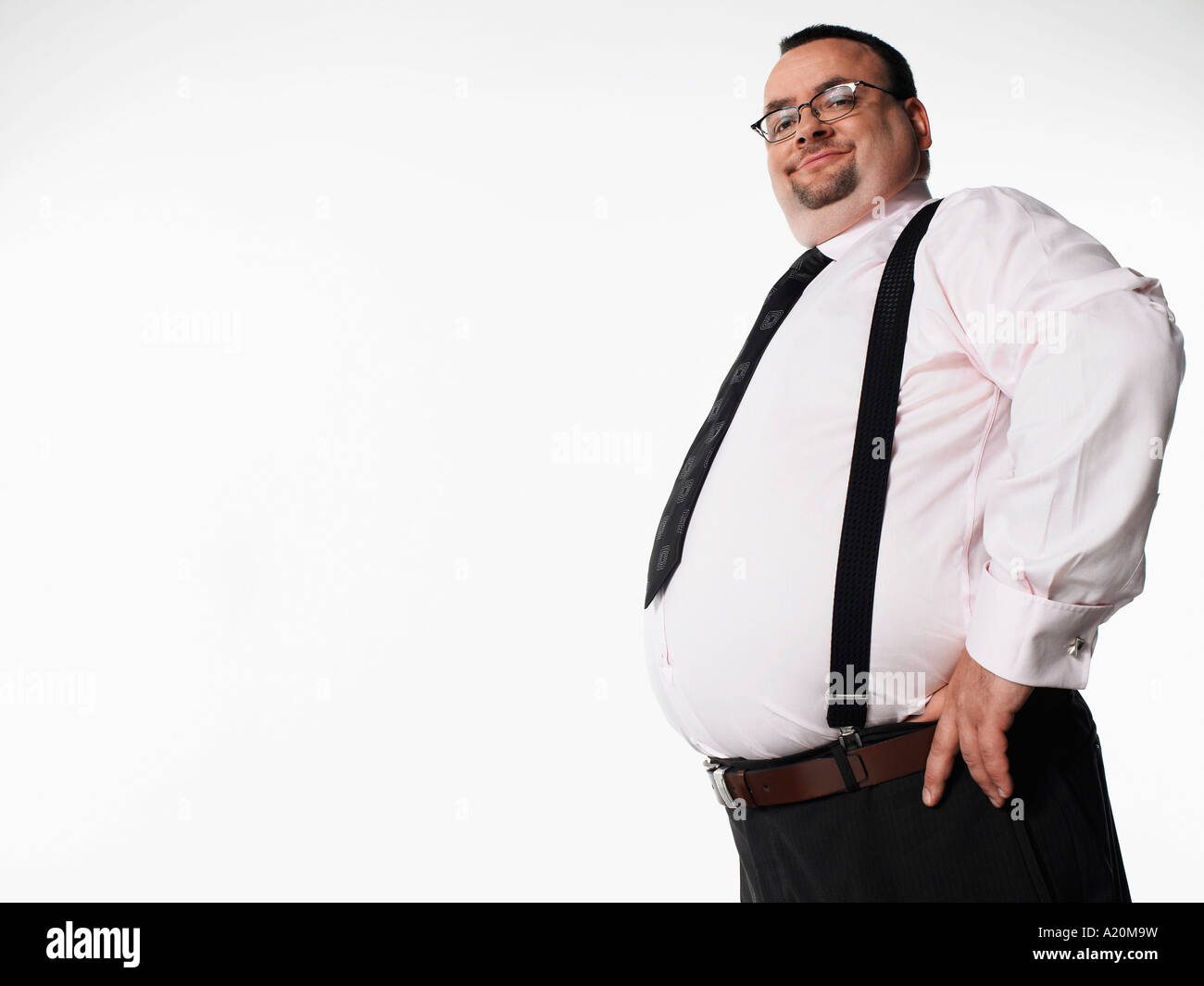 Confident overweight businessman, side view Stock Photo - Alamy