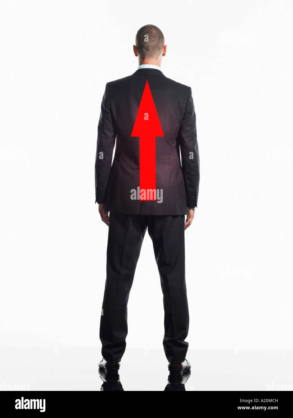 Young businessman with red Arrow on Back, back view Stock Photo - Alamy