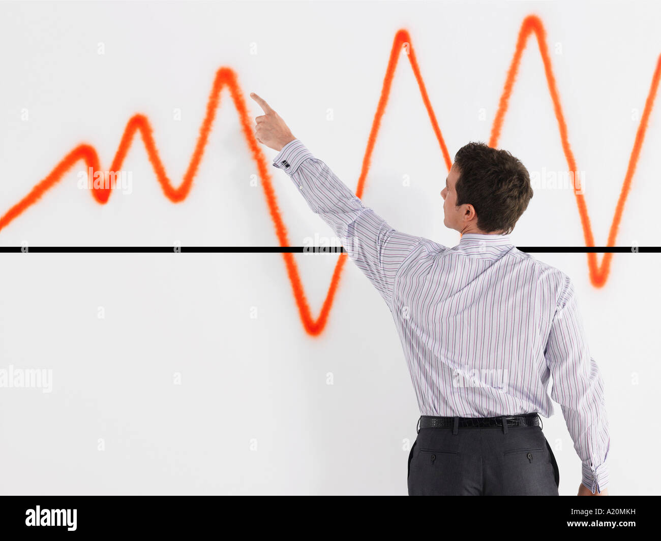 Businessmen looking at graph, back view Stock Photo - Alamy