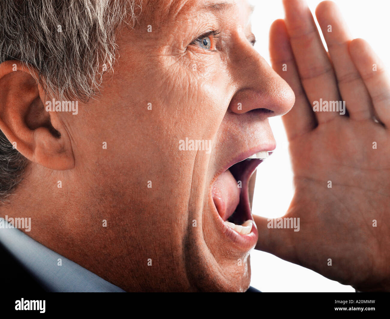 Man yelling, side view close-up Stock Photo - Alamy