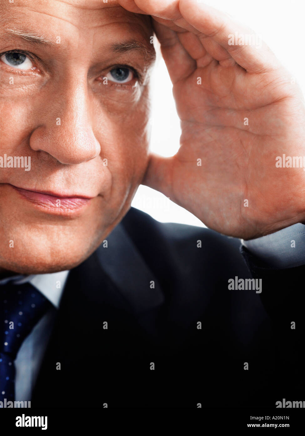 Business man holding hand up to face, close up Stock Photo - Alamy