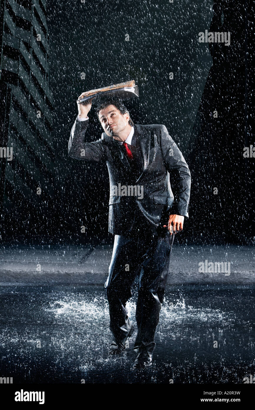 Businessman running rain hi-res stock photography and images - Alamy