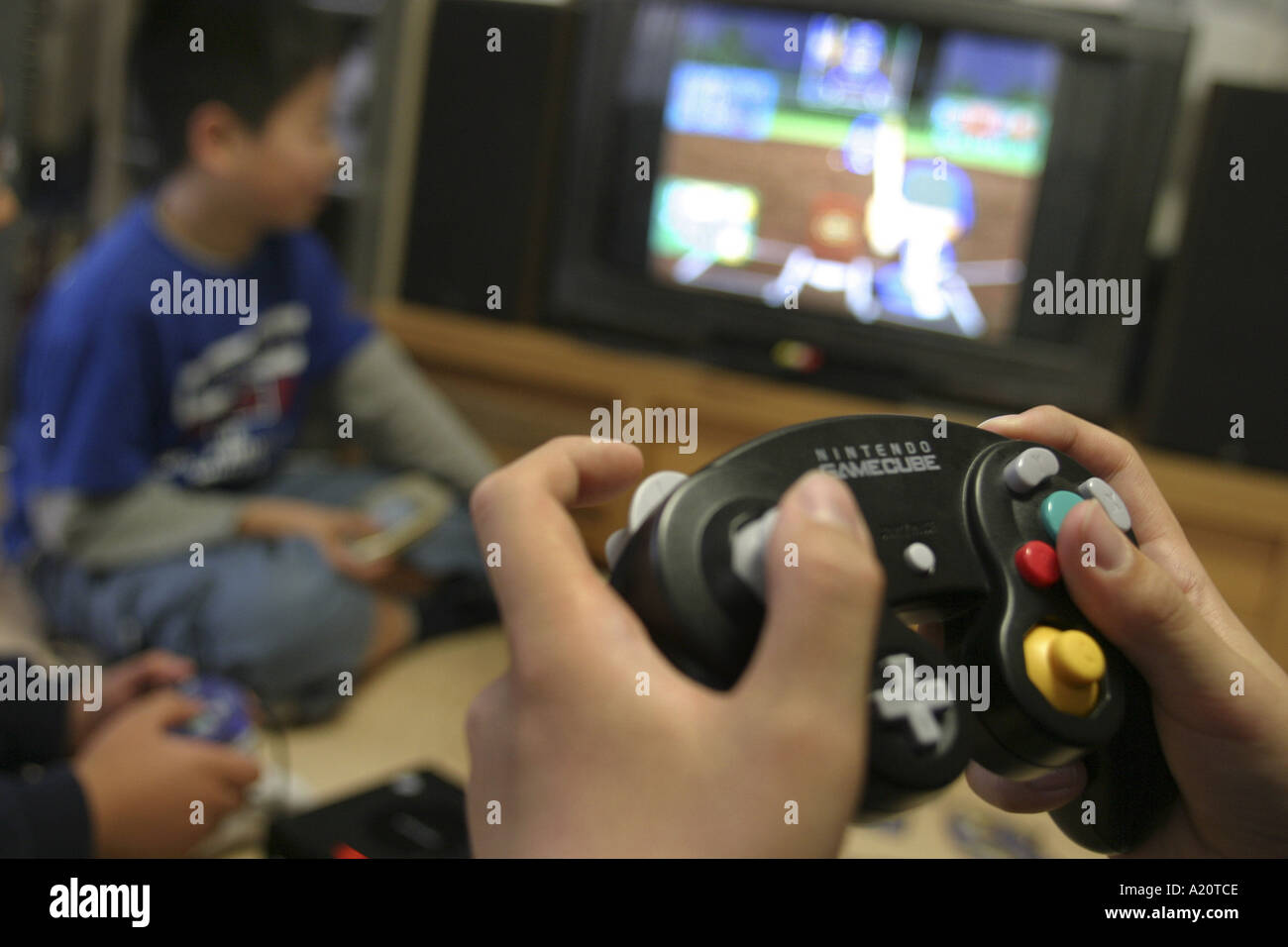Japanese children playing Nintendo Gamecube and Gameboy, Tokyo, Japan ...