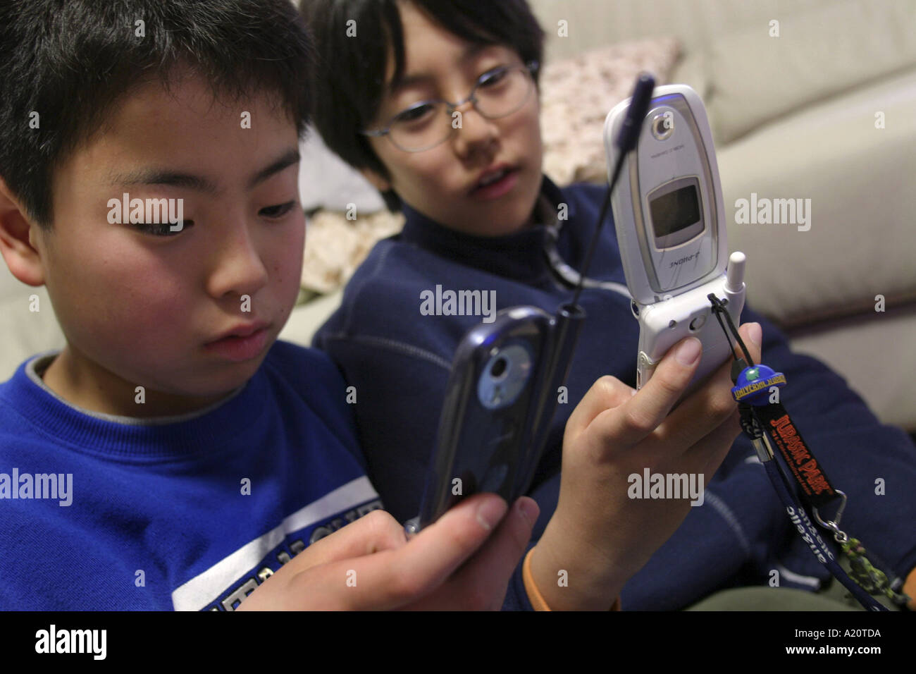 Japanese children playing with their mobile phones, Tokyo, Japan Stock ...