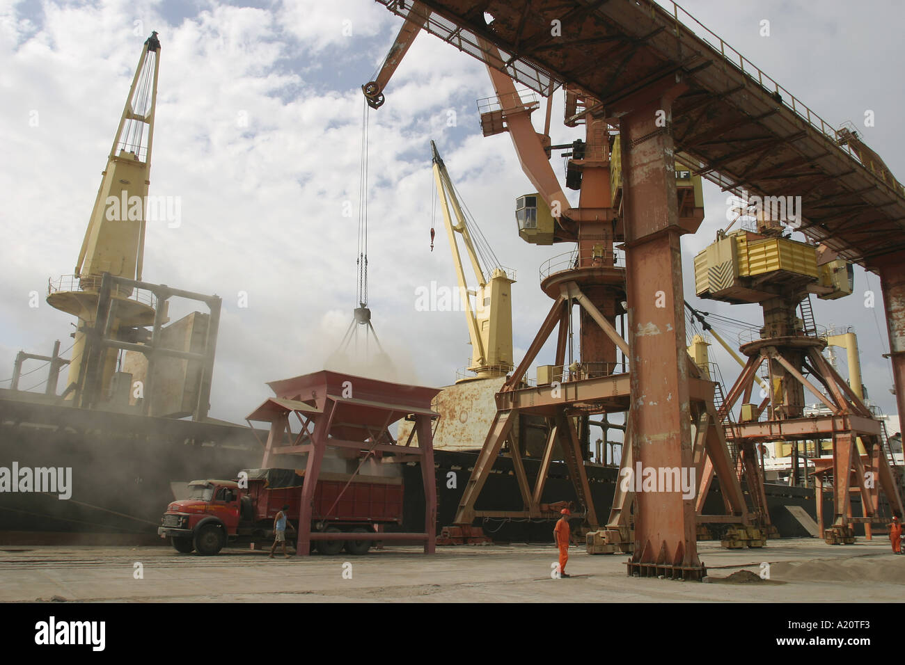 A cargo ship unloads its cargo in the old dock port side of Rio Grande ...