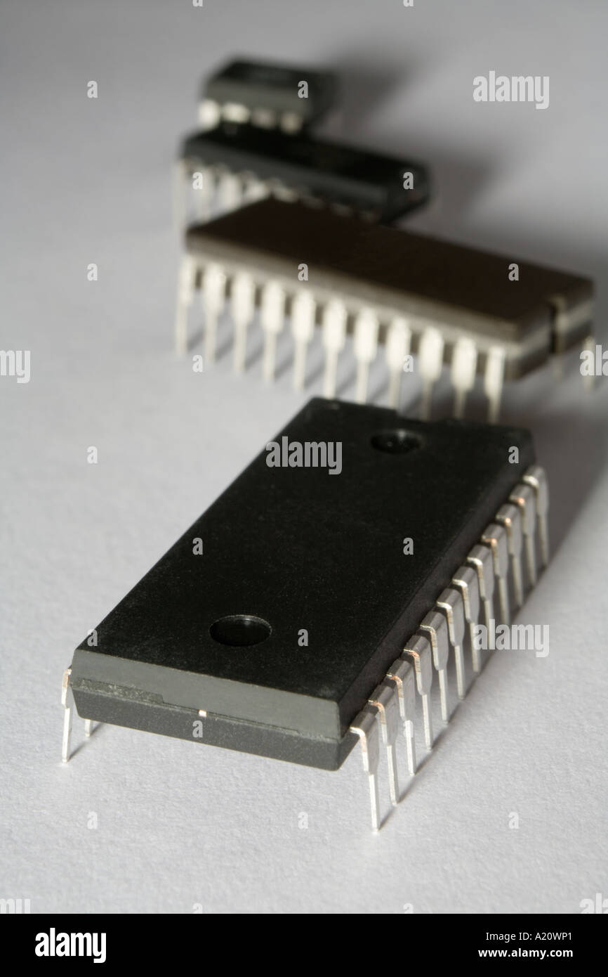 image off four computer chips lined up on a white surface Stock Photo ...