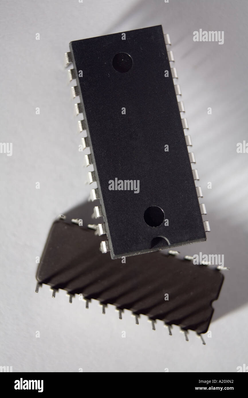 large computer chip standing on smaller one Stock Photo - Alamy