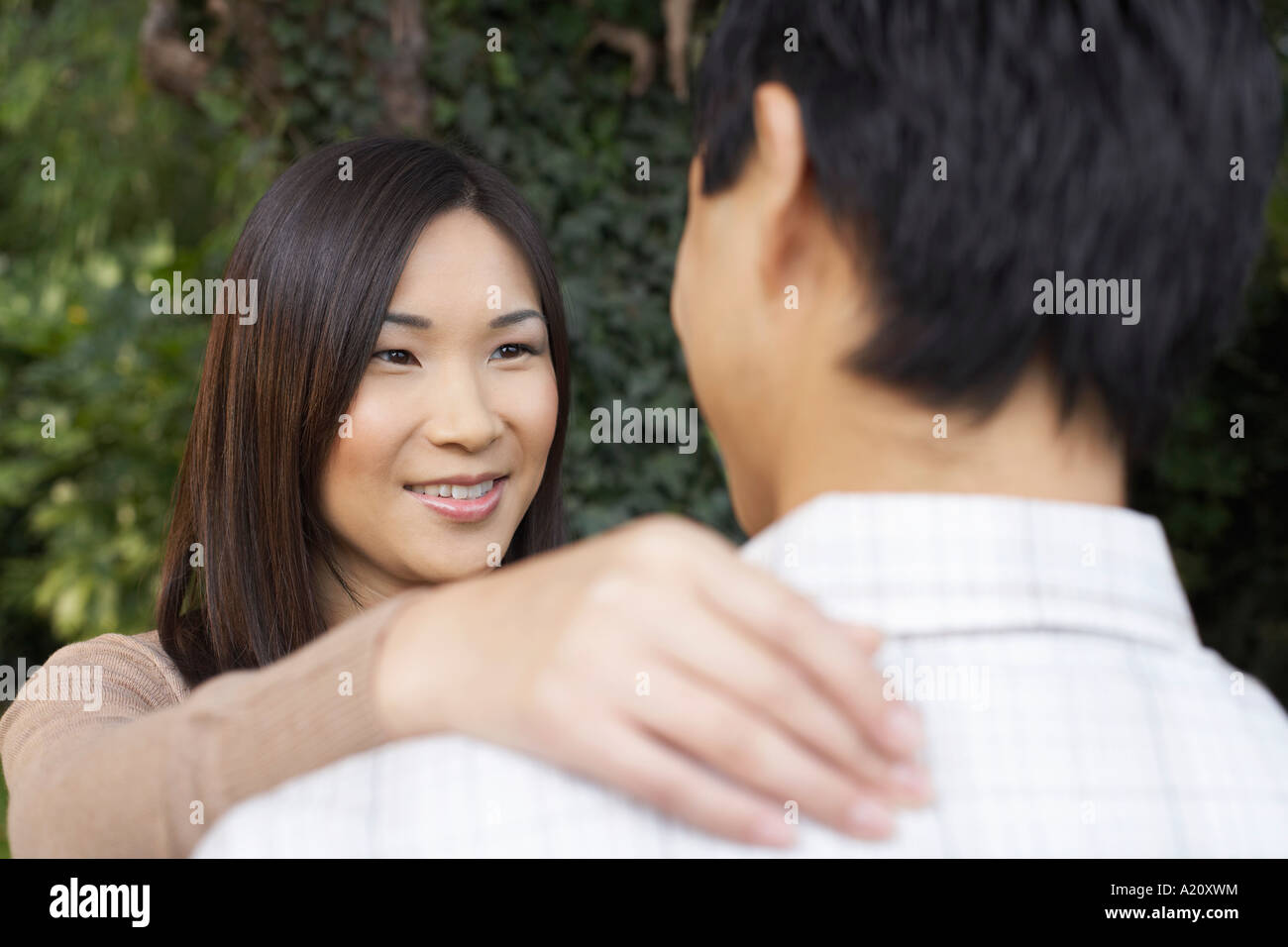 Woman with man hand on shoulder hi-res stock photography and images - Alamy