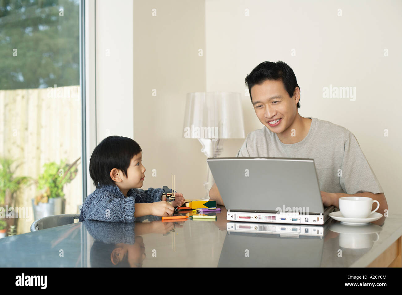 Father and son 4 5 at laptop hi-res stock photography and images - Alamy