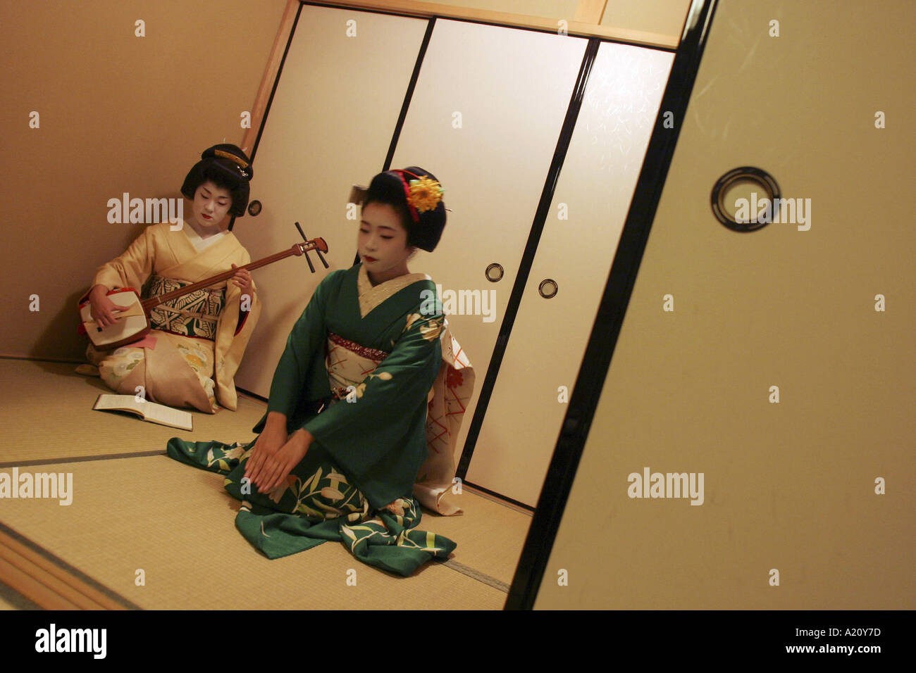 Geisha and maiko girl perform for clients, Kyoto, Japan Stock Photo - Alamy