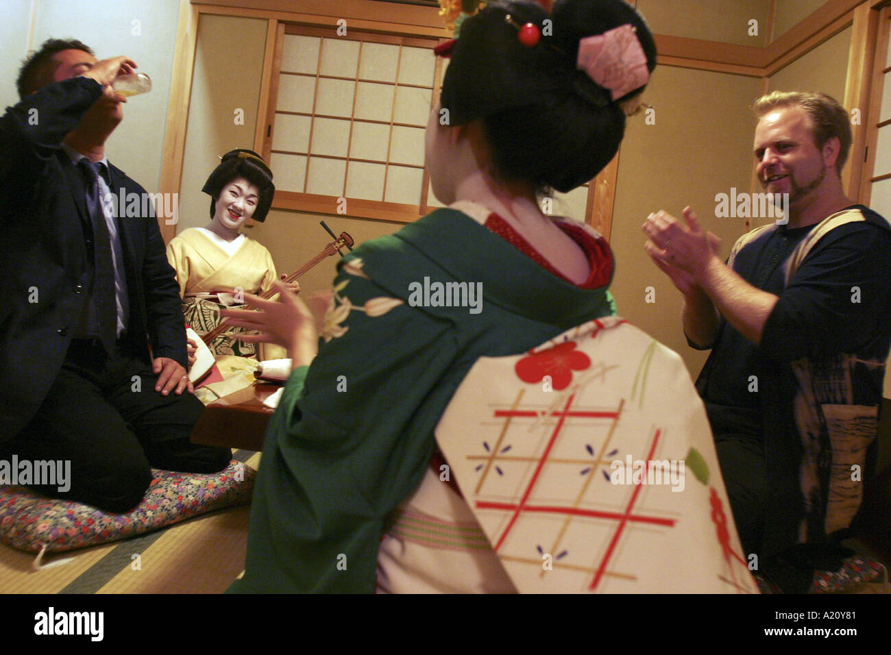 Japanese Geisha girls and western male clients, Kyoto, japan Stock ...