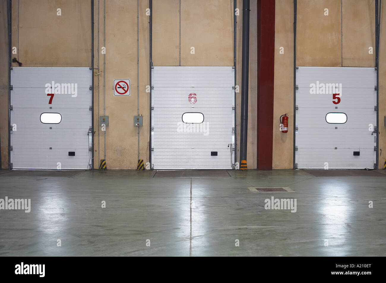 Loading Dock Doors in warehouse Stock Photo - Alamy