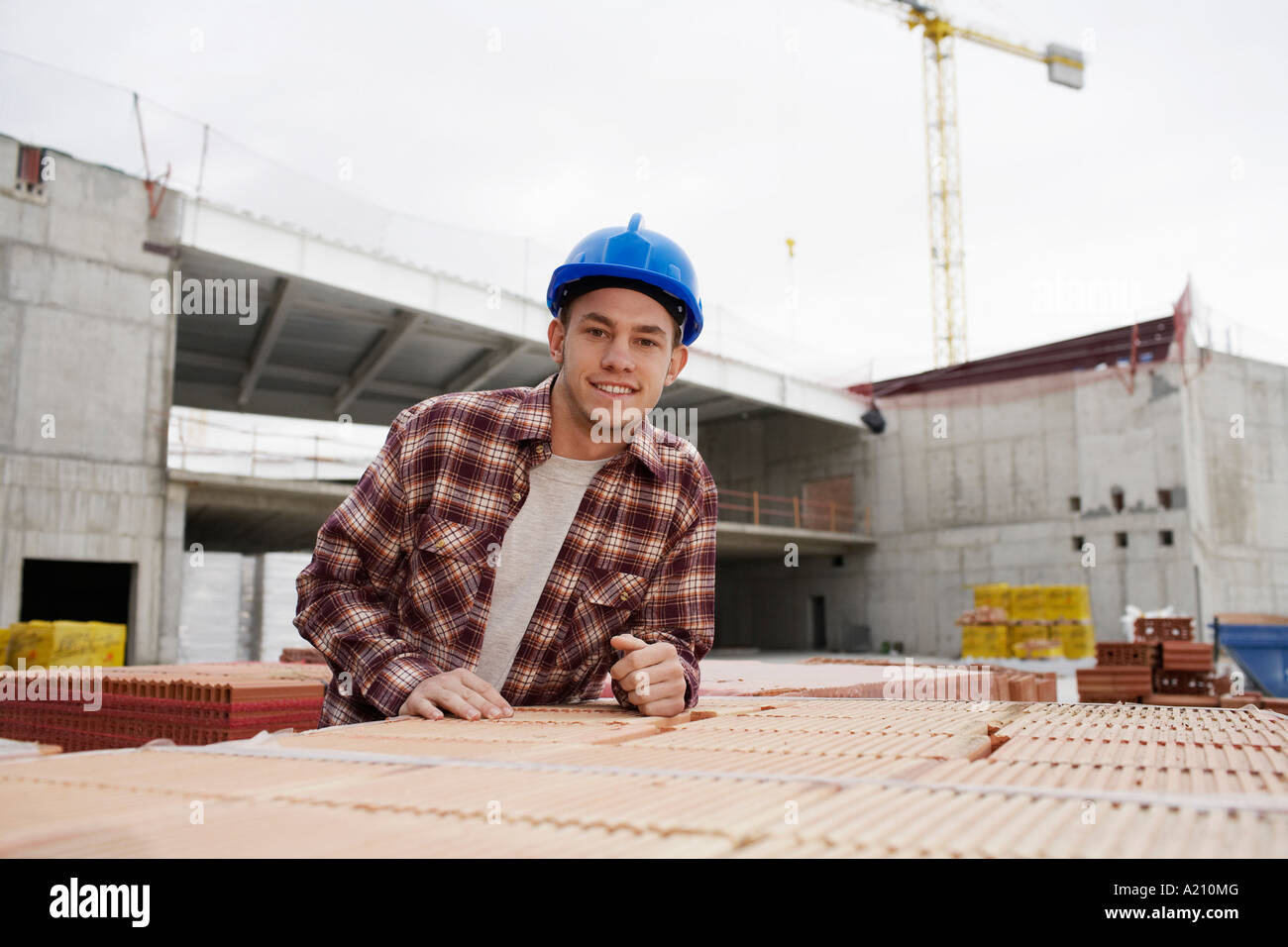 Young construction worker on building site Stock Photo - Alamy