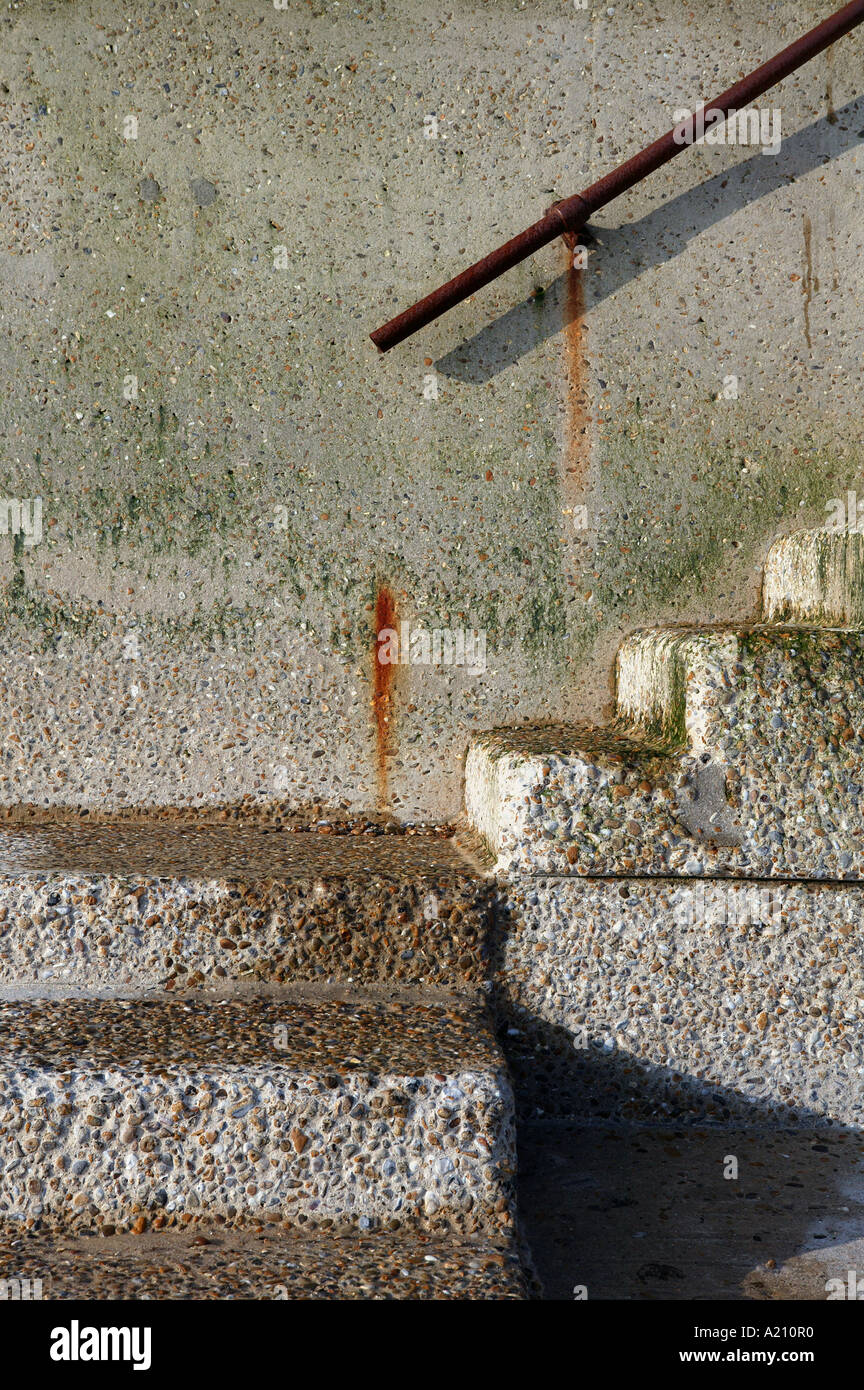Graphic shape steps on coastal sea wall Stock Photo - Alamy