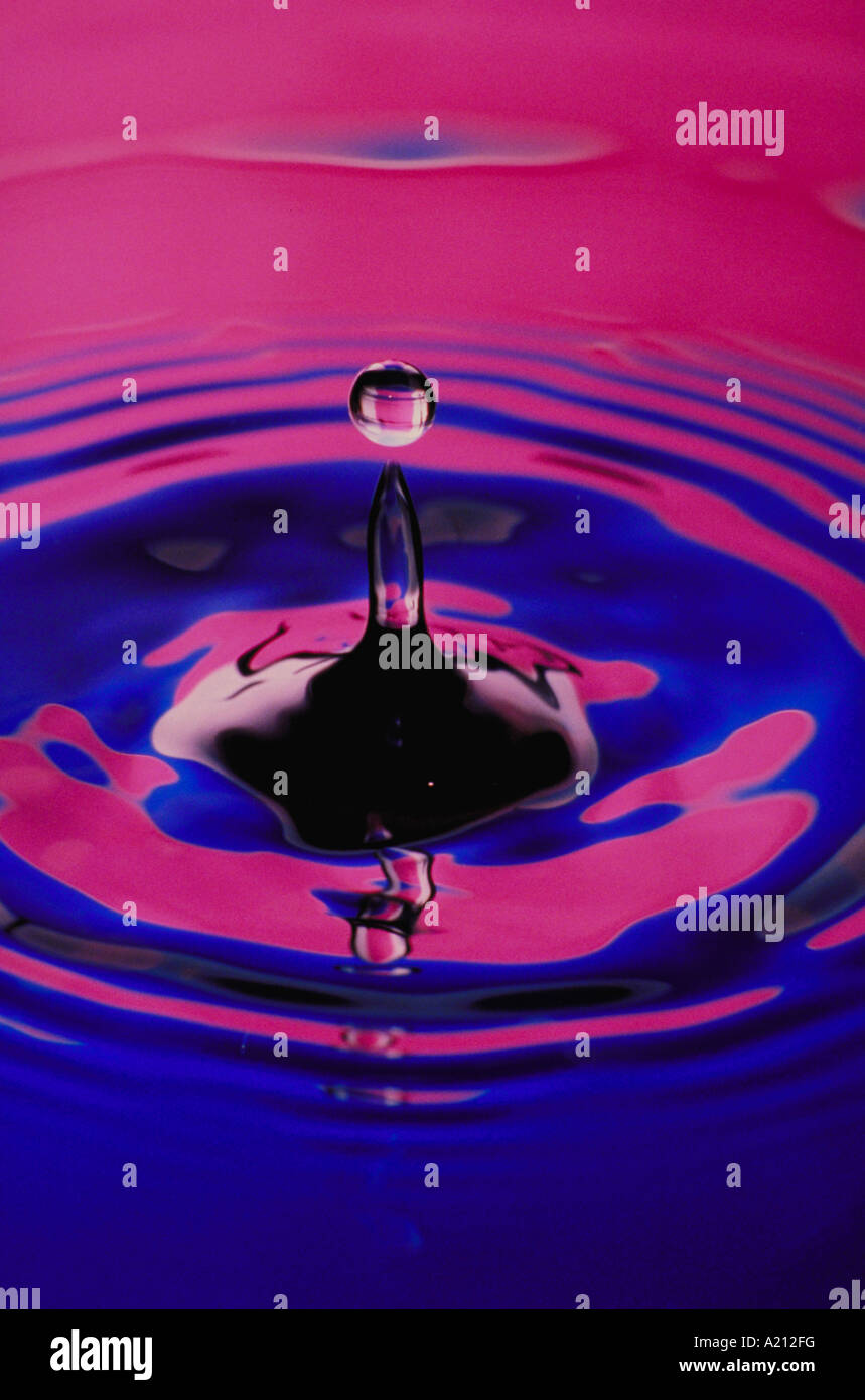 Water drop with pink coloring Stock Photo - Alamy