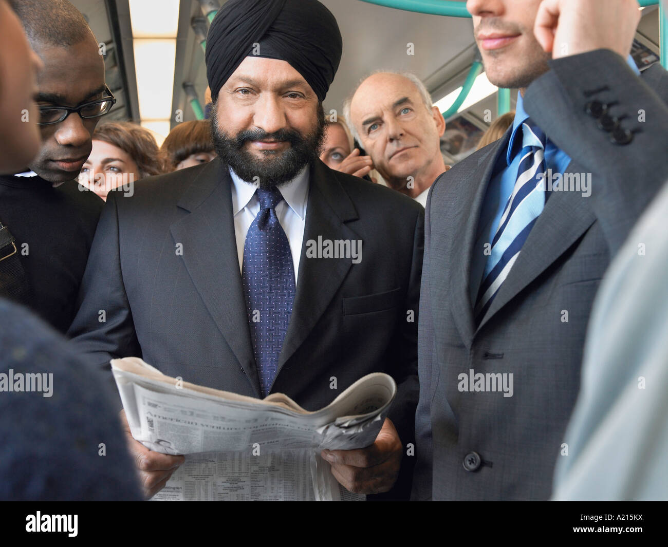 Commuter reading paper hi-res stock photography and images - Alamy