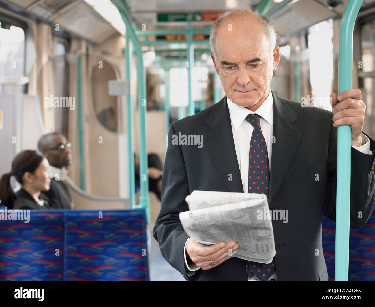 Woman commuter train newspaper hi-res stock photography and images - Alamy