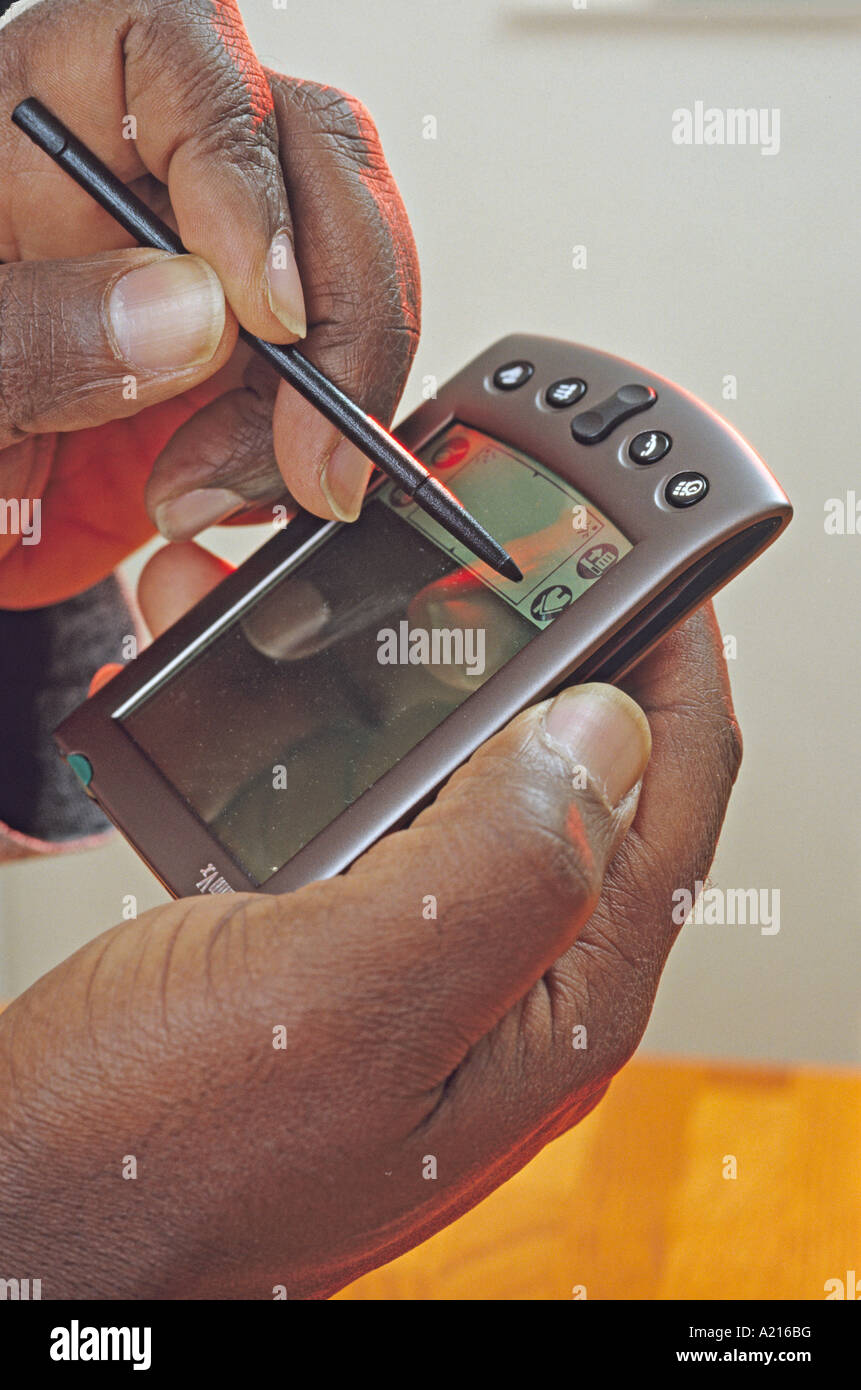African American man hands using Personal Digital Assistant PDA Stock ...
