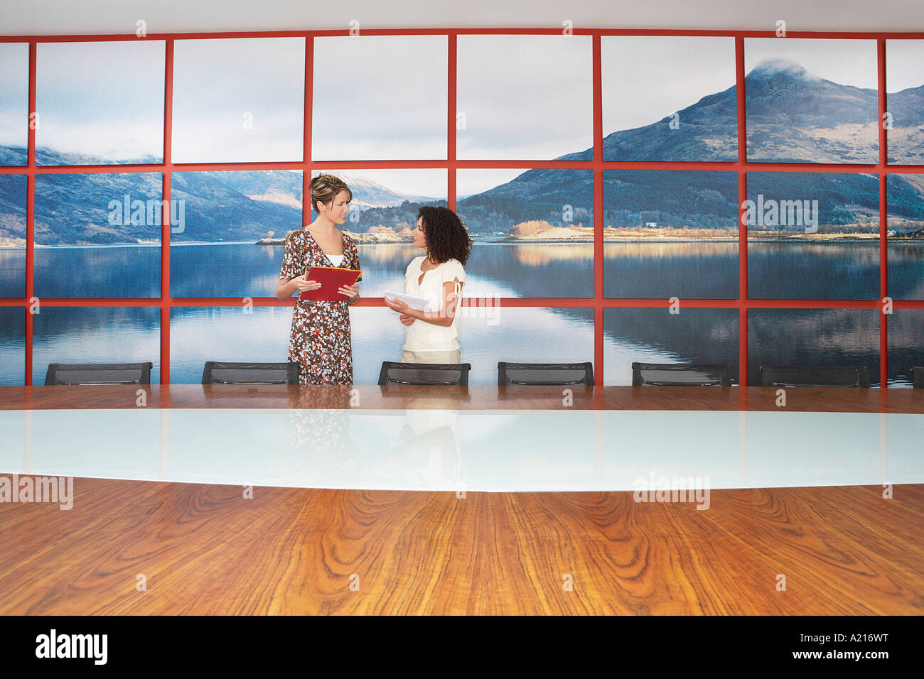 Businesswomen standing, Talking in modern Conference Room Stock Photo ...