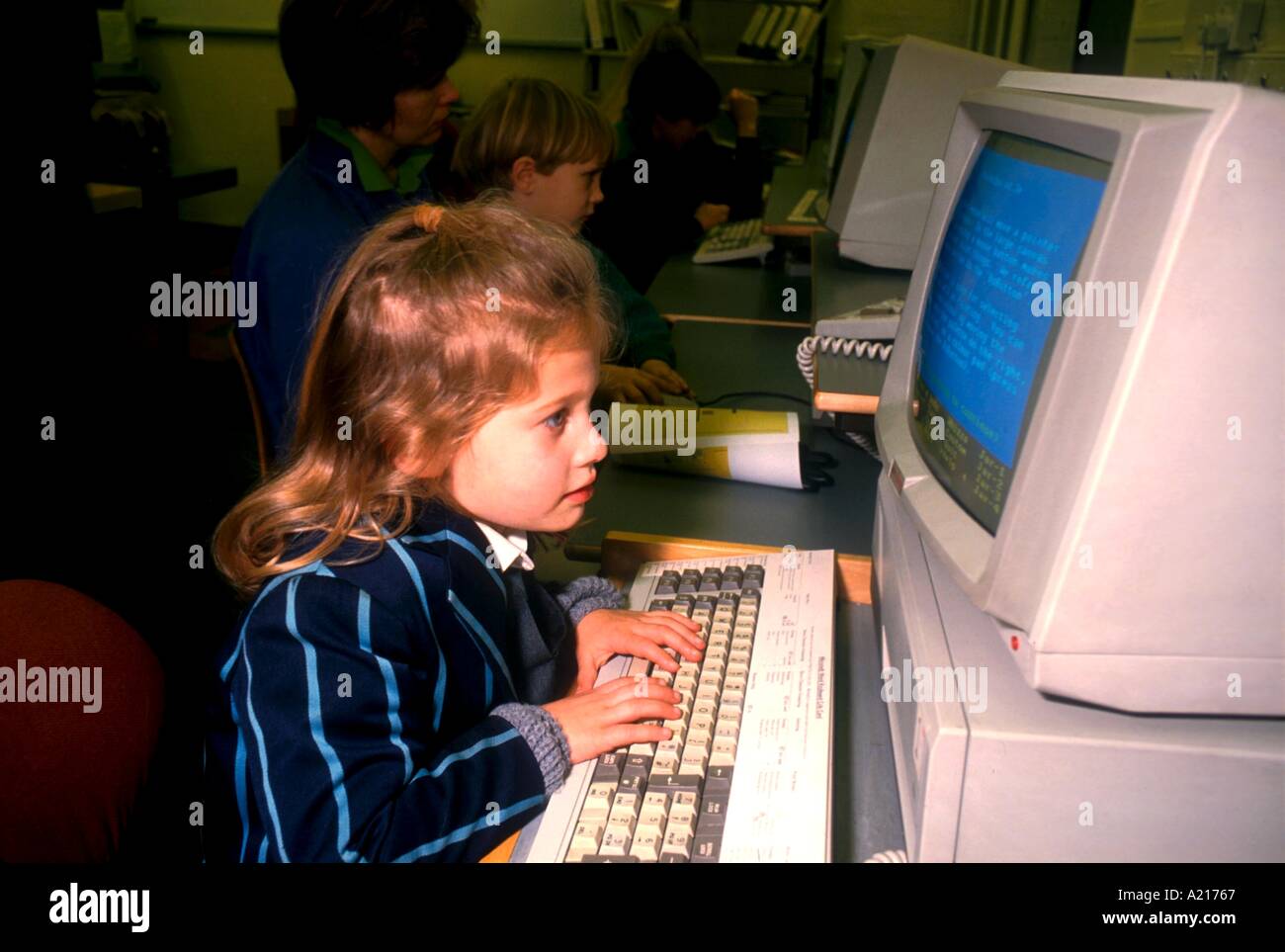 Young girl learning to use computer Wandsworth School London England UK ...