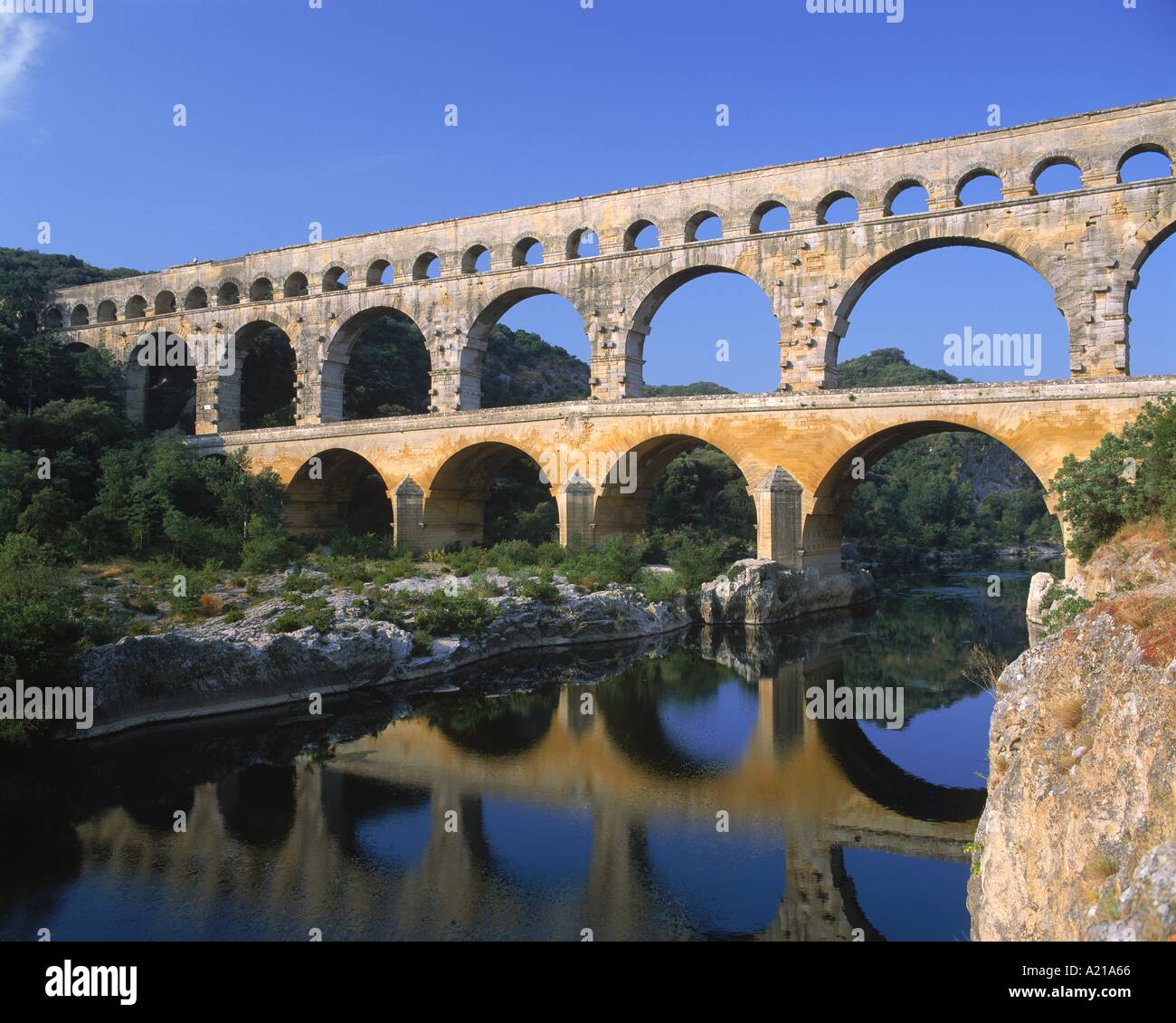 Reflections in the river of the Roman bridge the Pont du Gard near ...