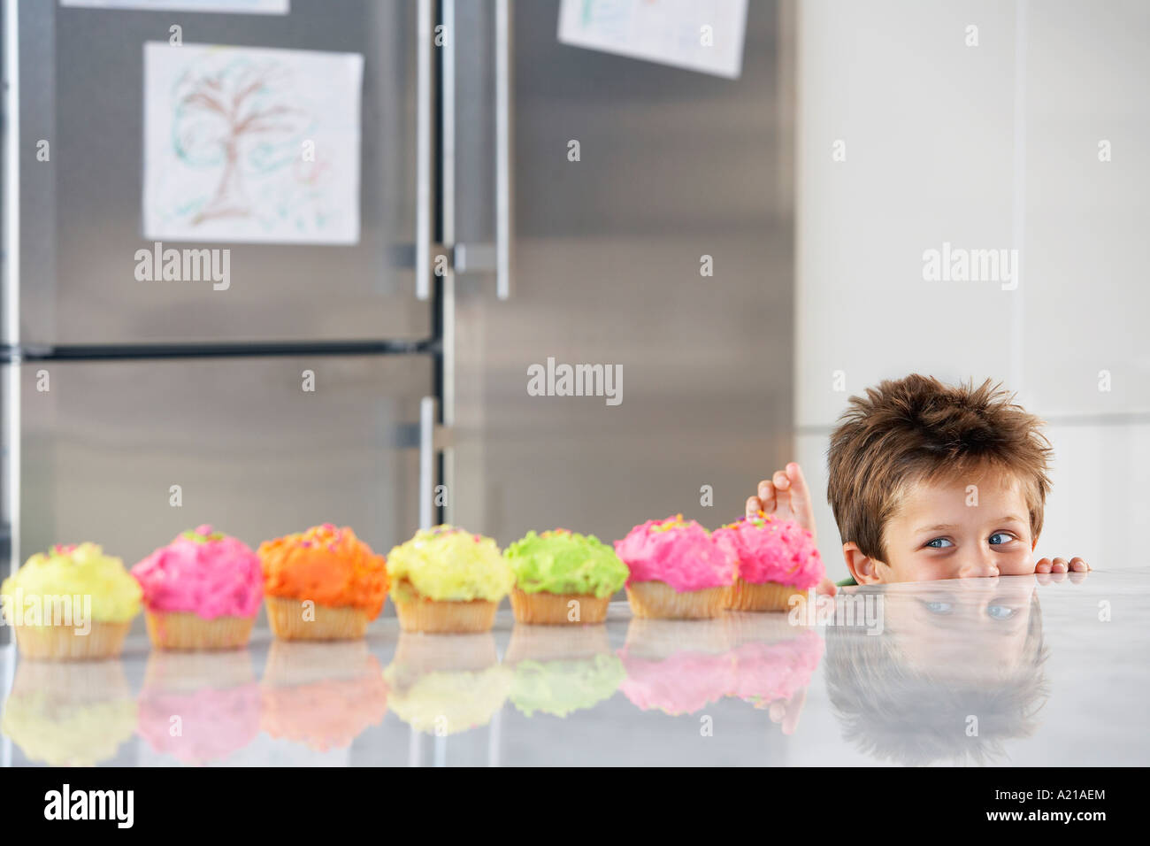 Boy peeking over kitchen counter hi-res stock photography and images ...