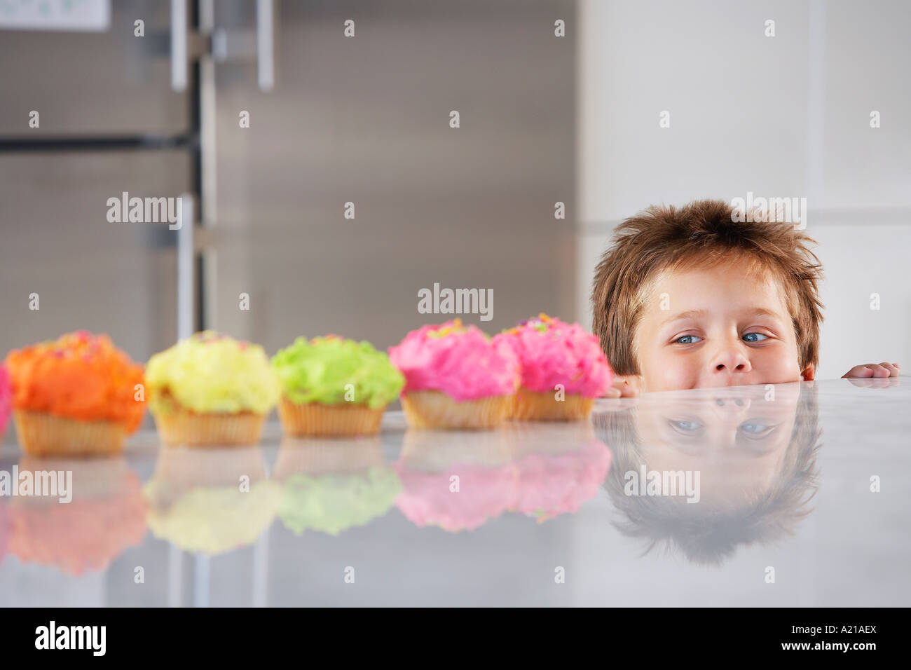 Boy peeking over counter hi-res stock photography and images - Alamy
