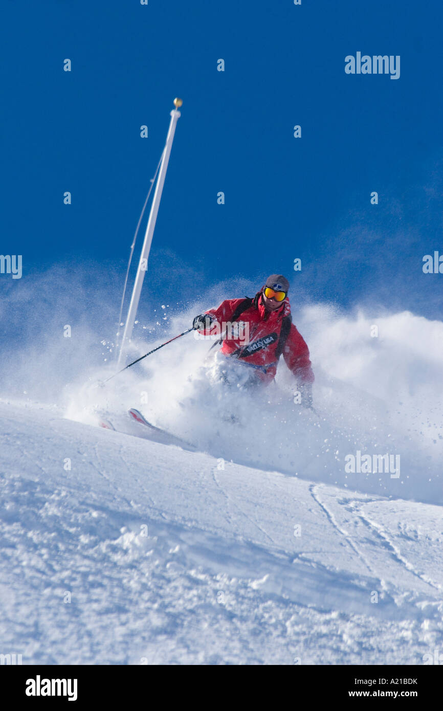 A Squaw Valley ski patroller skiing deep powder snow at Squaw Valley in ...