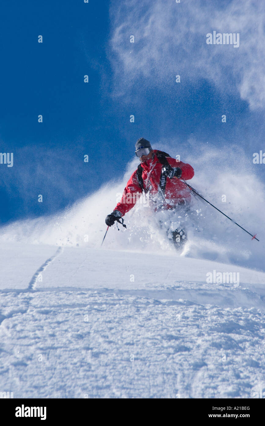 A Squaw Valley ski patroller skiing deep powder snow at Squaw Valley in ...