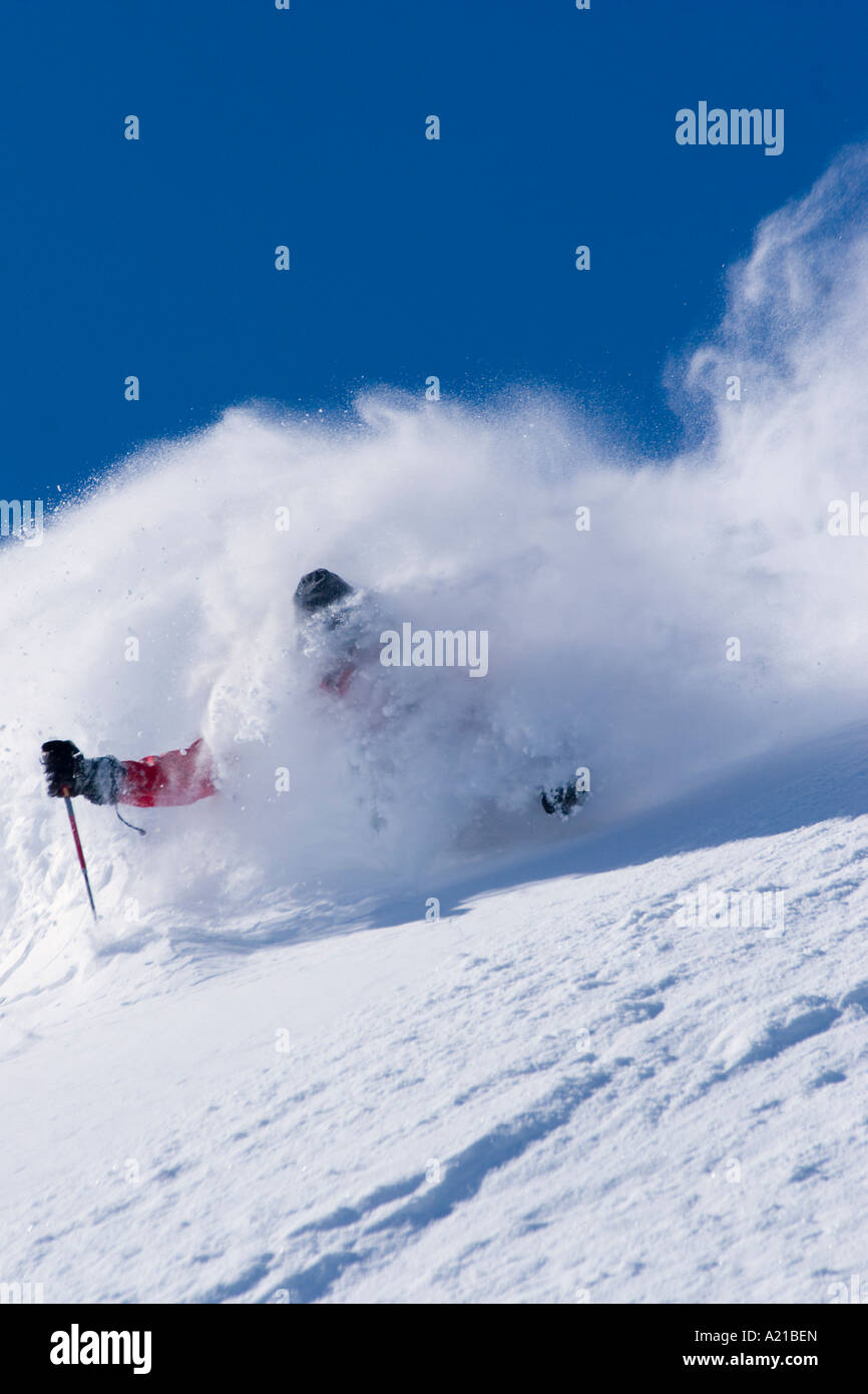A Squaw Valley ski patroller skiing deep powder snow at Squaw Valley in ...