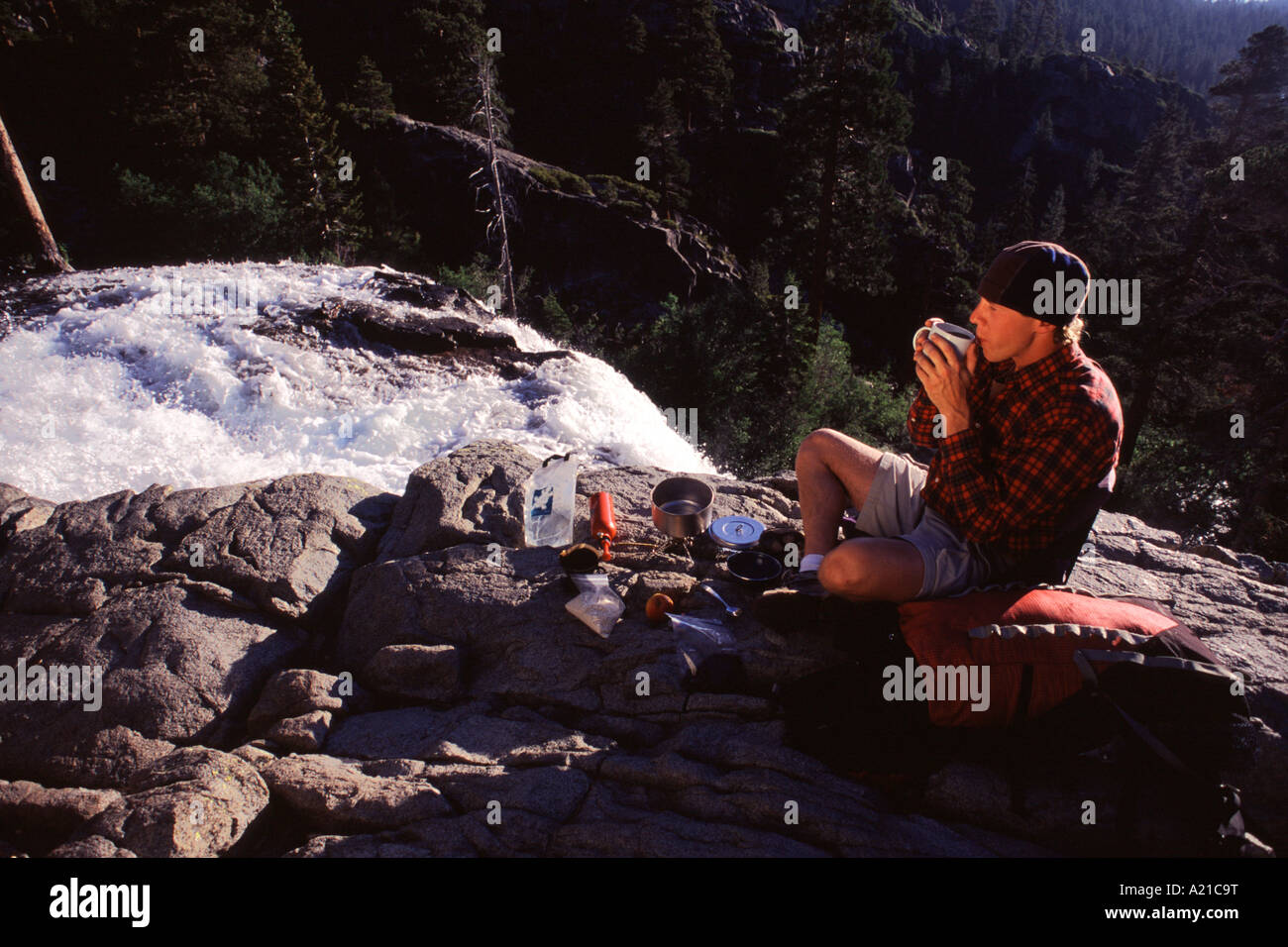 A man drinking tea by a waterfall near Lake Tahoe in California Stock ...