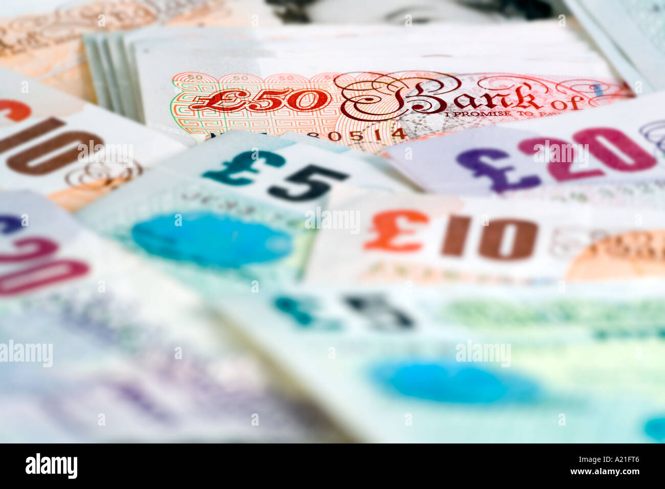 Twenty pound and fifty pound notes with one pound coins hi-res stock ...
