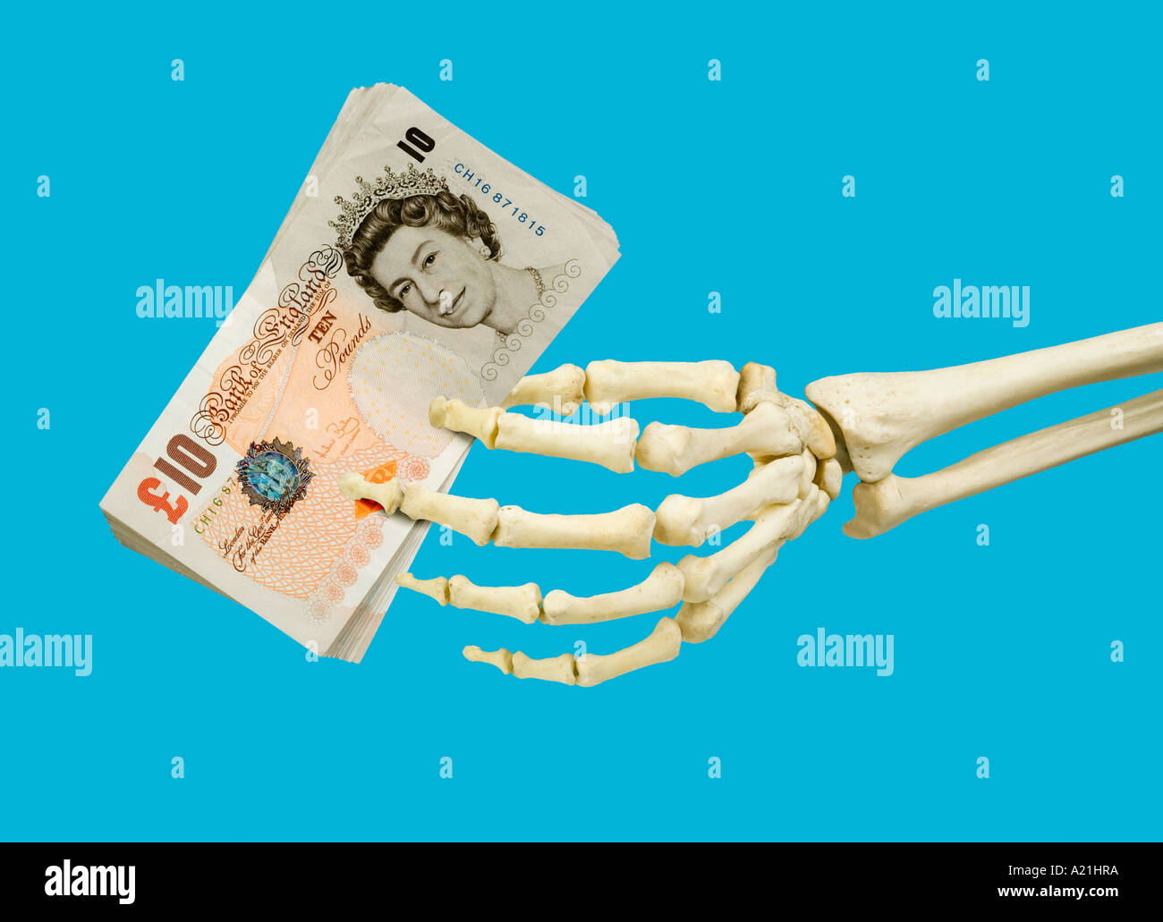 Human skeleton left hand holding British ten 10 pound notes Stock Photo ...
