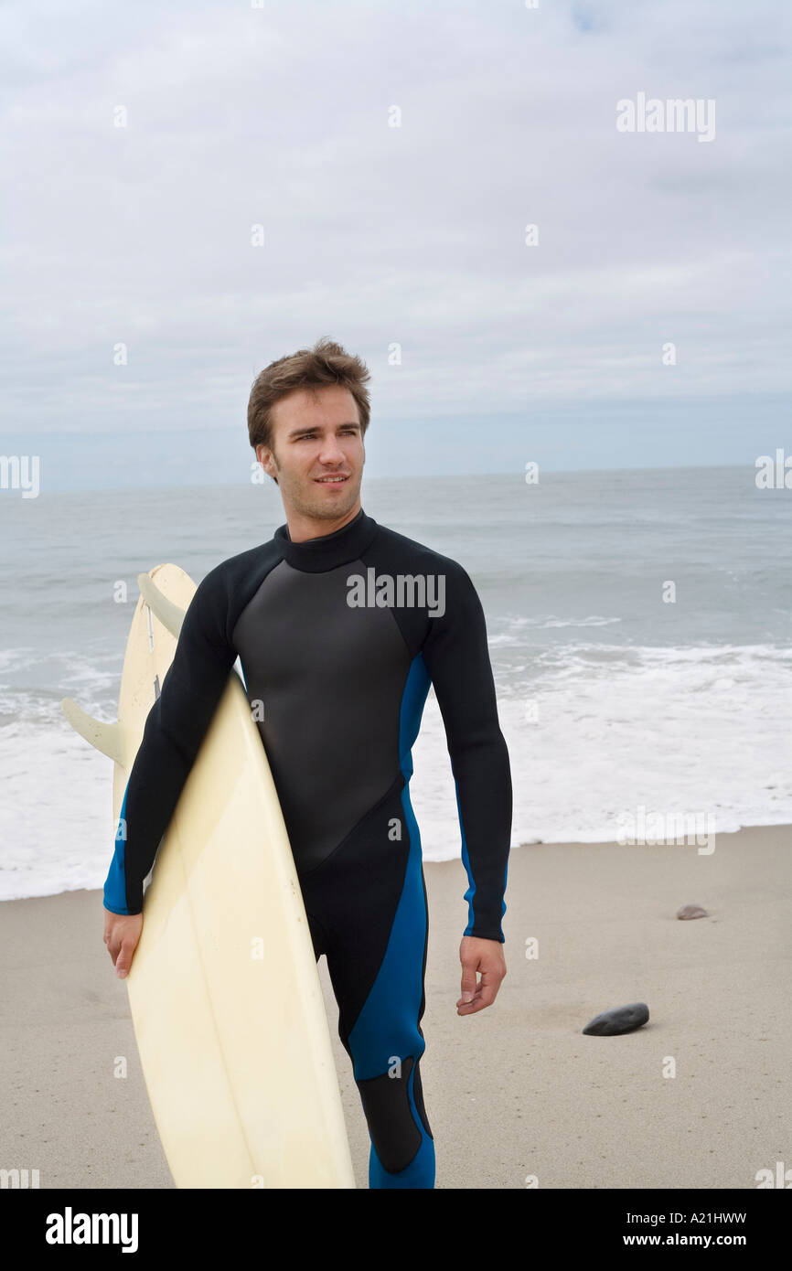 Man Holding Surfboard Stock Photo - Alamy