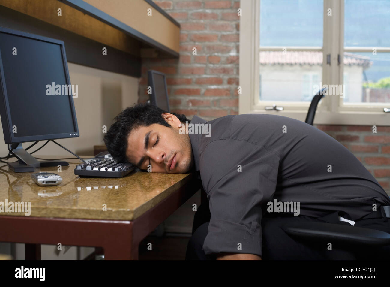 Sleeping off computer desktop hi-res stock photography and images - Alamy